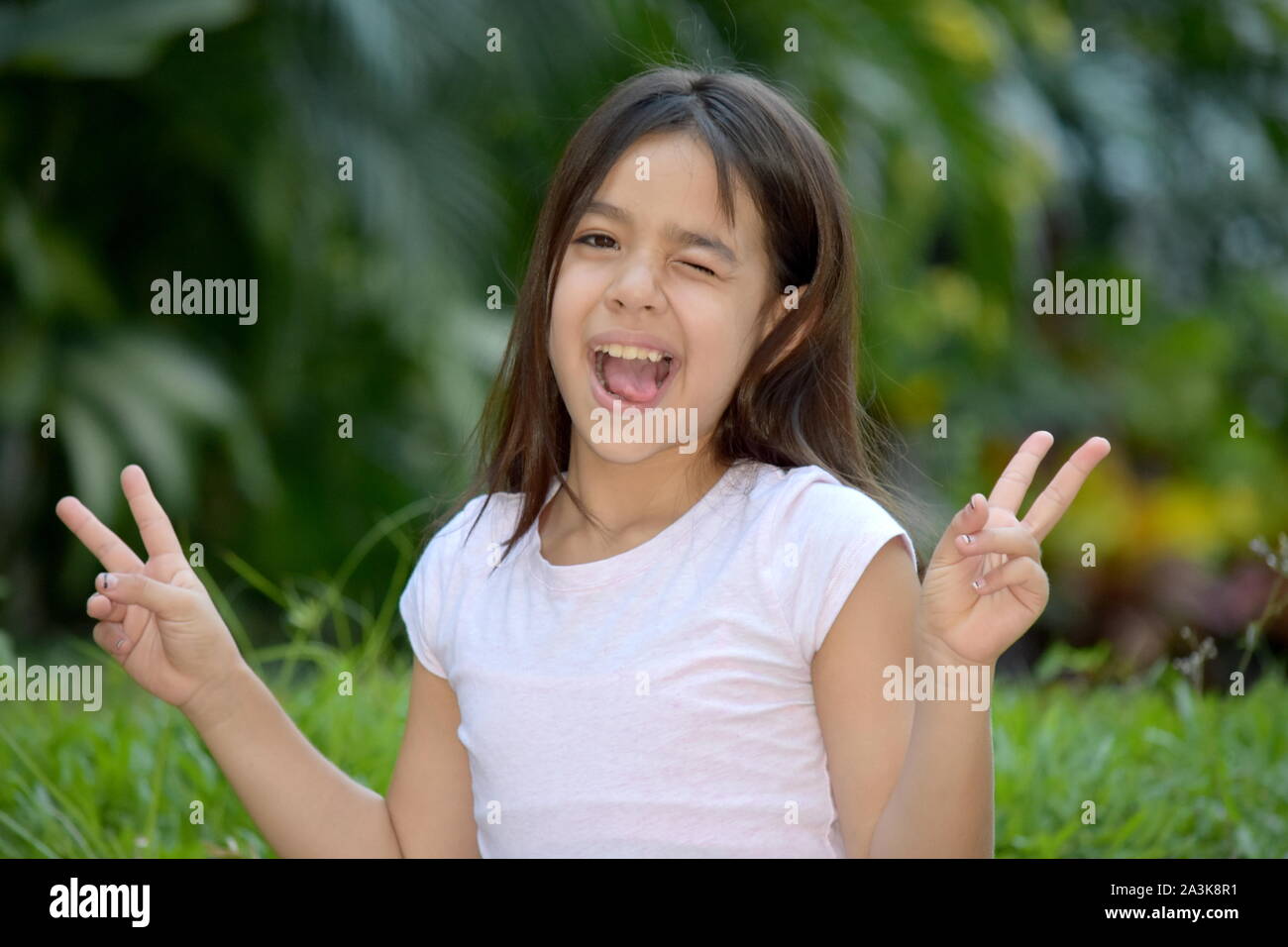 Cute Asian Girl And Peace Sign Stock Photo - Alamy