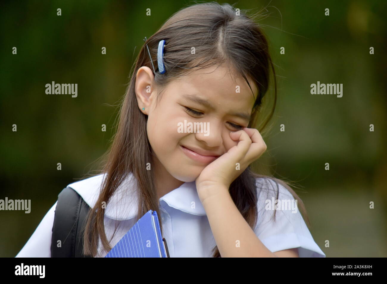 Crying Cute Diverse Girl Student Wearing Uniform Stock Photo - Alamy