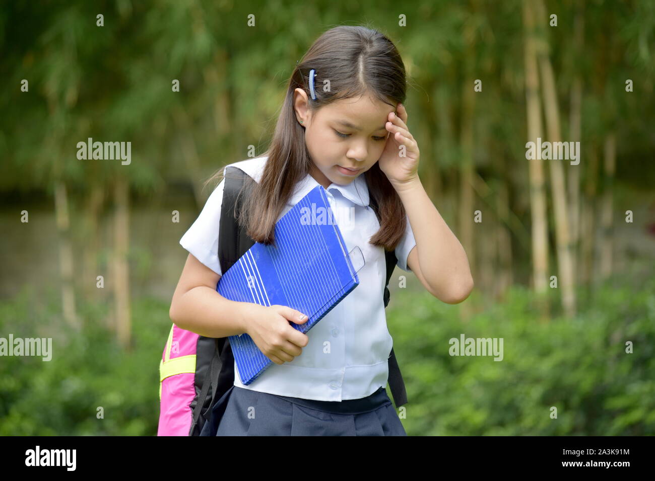 Depressed Girl Student Wearing Uniform Stock Photo - Alamy