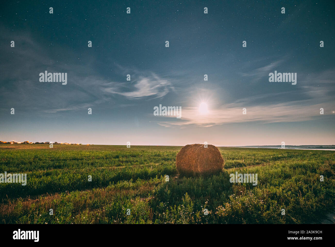 Natural Night Starry Sky Above Field Meadow With Hay Bale After Harvest ...