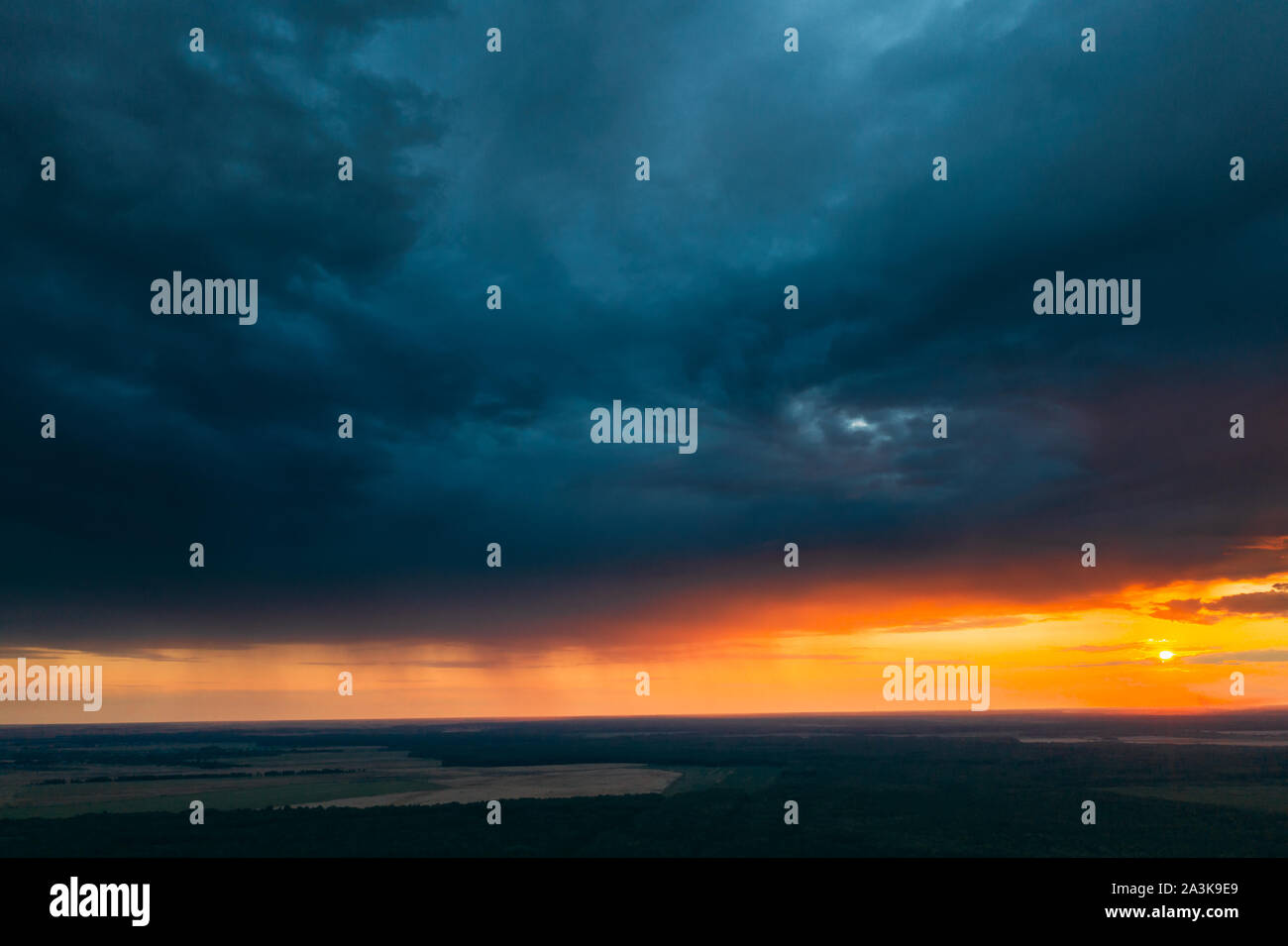 Aerial View Of Sunset Sky Above Green Forest Landscape In Evening. Top ...