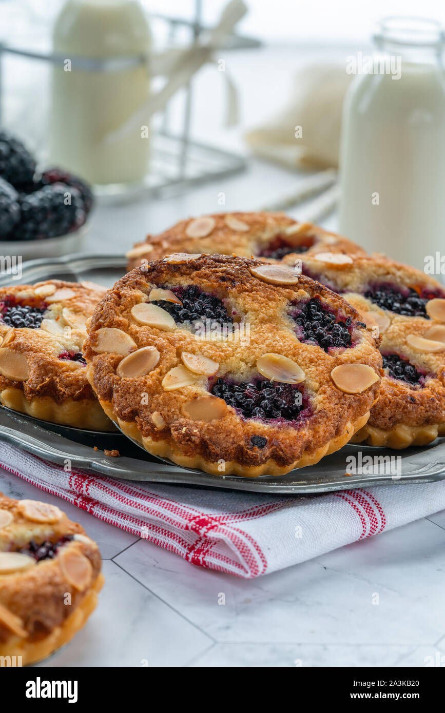 Mini blackberry bakewell tarts Stock Photo - Alamy