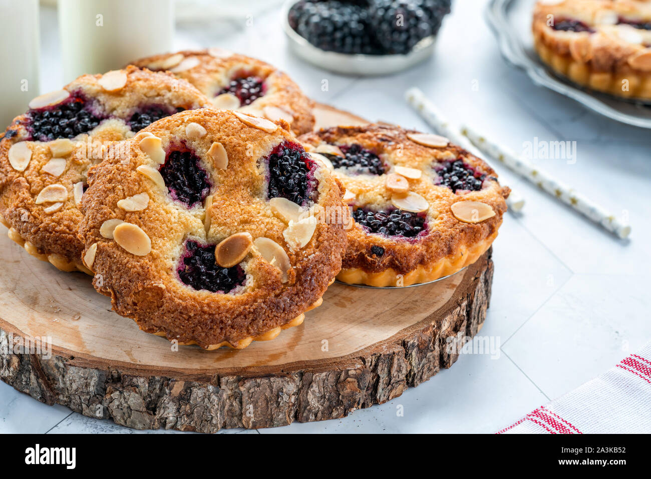 Mini blackberry bakewell tarts Stock Photo - Alamy