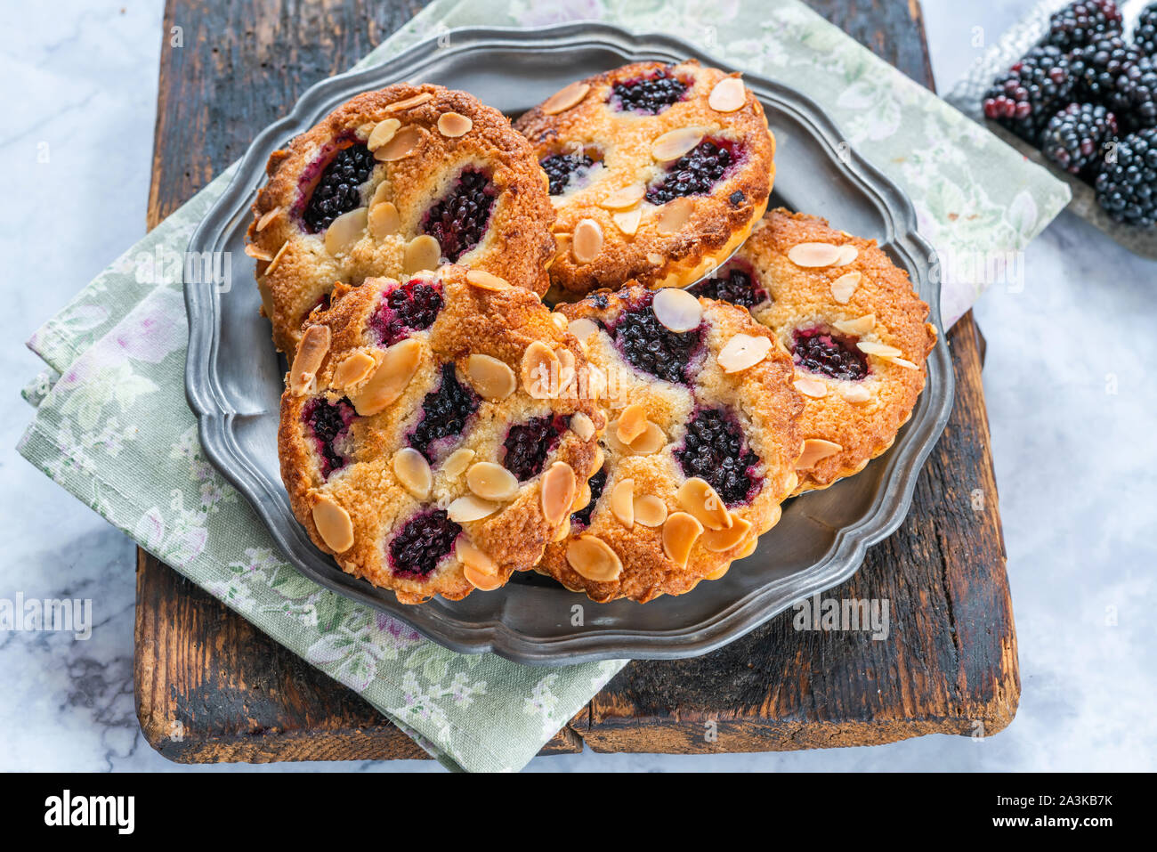 Mini blackberry bakewell tarts Stock Photo - Alamy