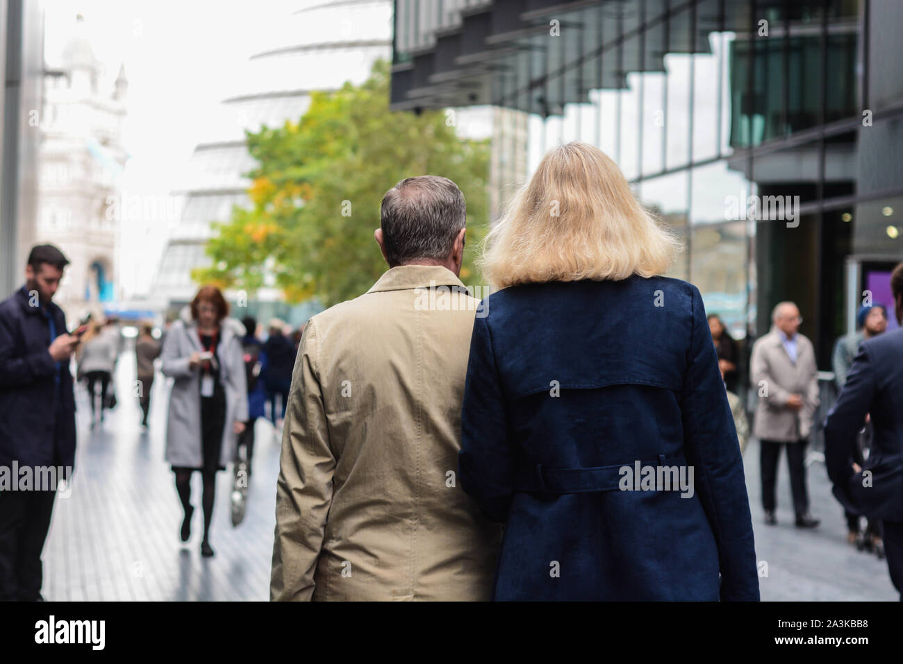 People dressed in elegant business style outfits walking in office jobs ...