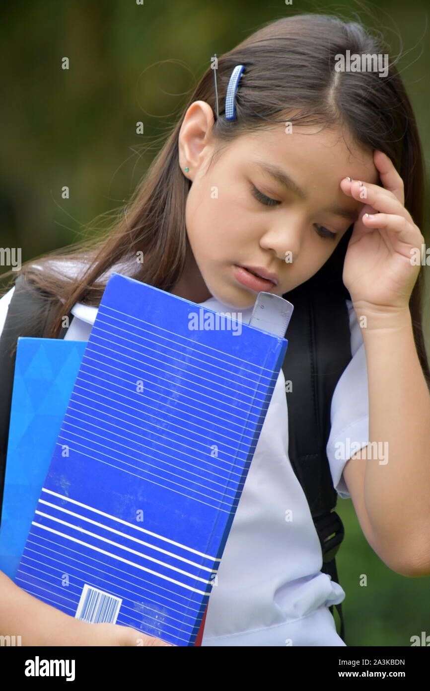Sad School Girl Wearing School Uniform With Notebooks Stock Photo - Alamy