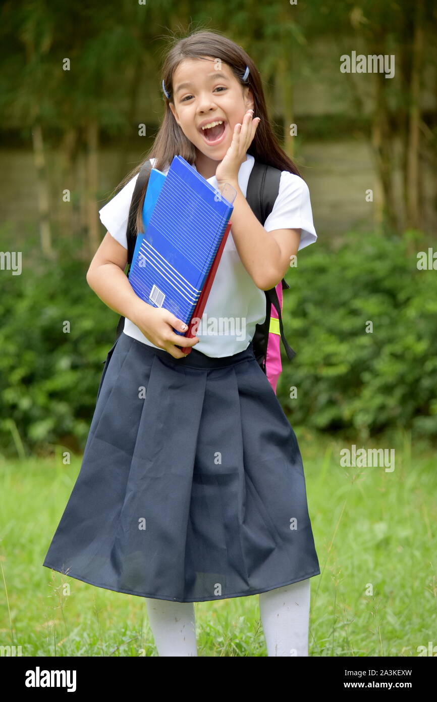 Surprised Prep Person With Books Stock Photo - Alamy