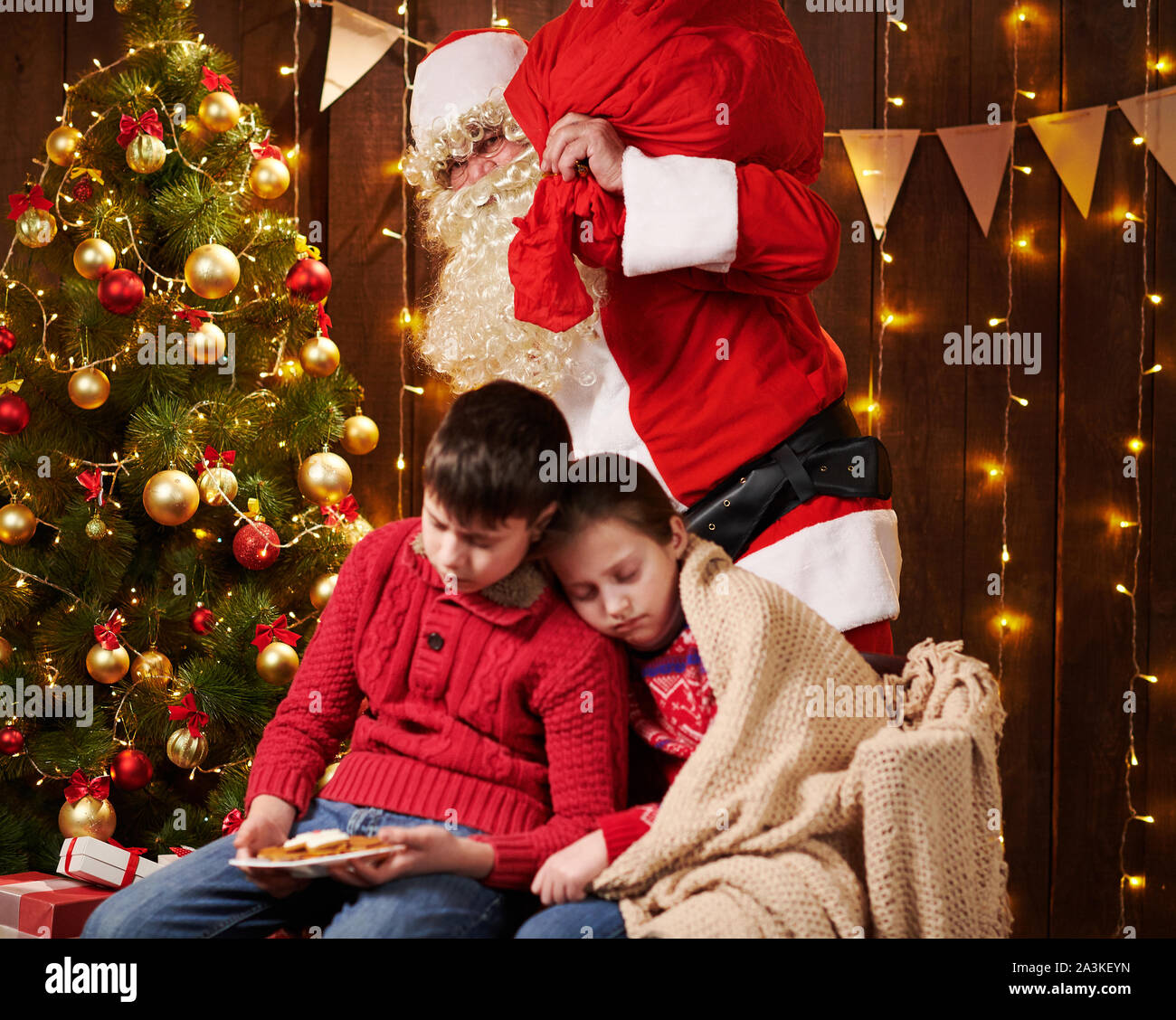 The children waited a long time for Santa, now they fell asleep and ...