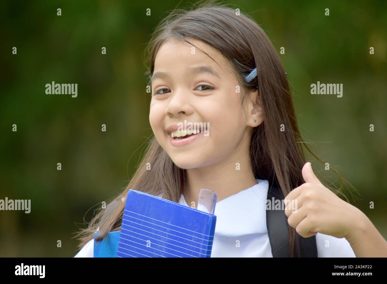 Happy Child Girl Student Wearing Uniform With Books Stock Photo - Alamy