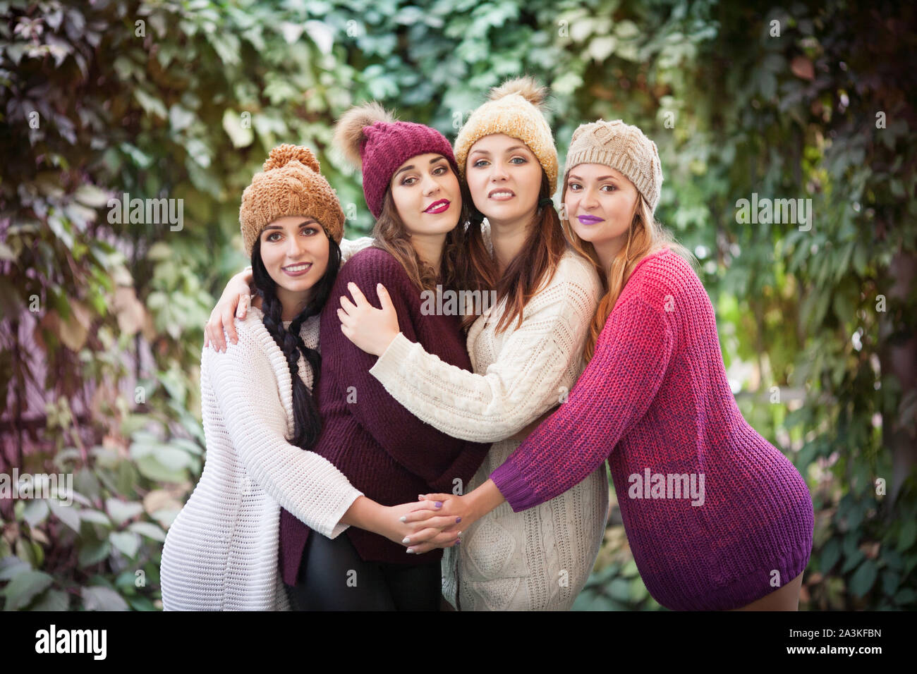 Women best friends hug in autumn park. Outdoors lifestyle fashion ...