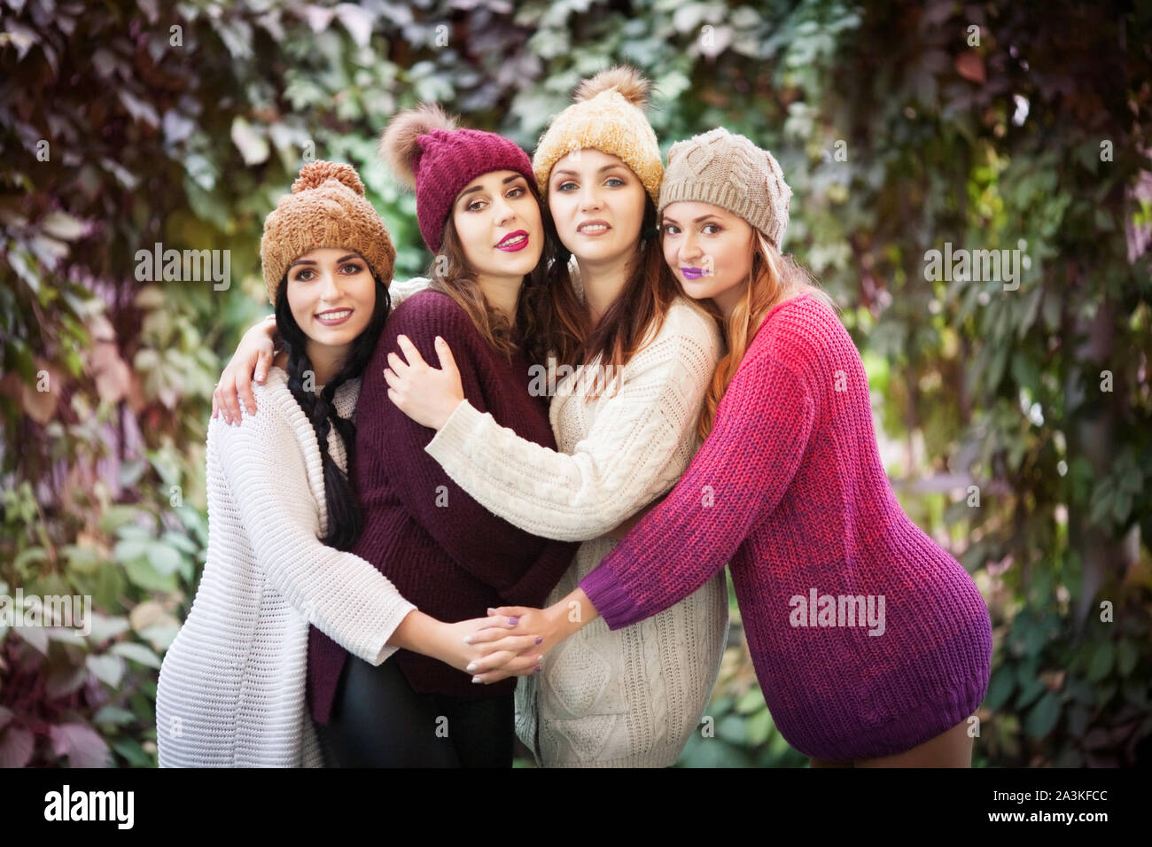 Women best friends hug in autumn park. Outdoors lifestyle fashion ...