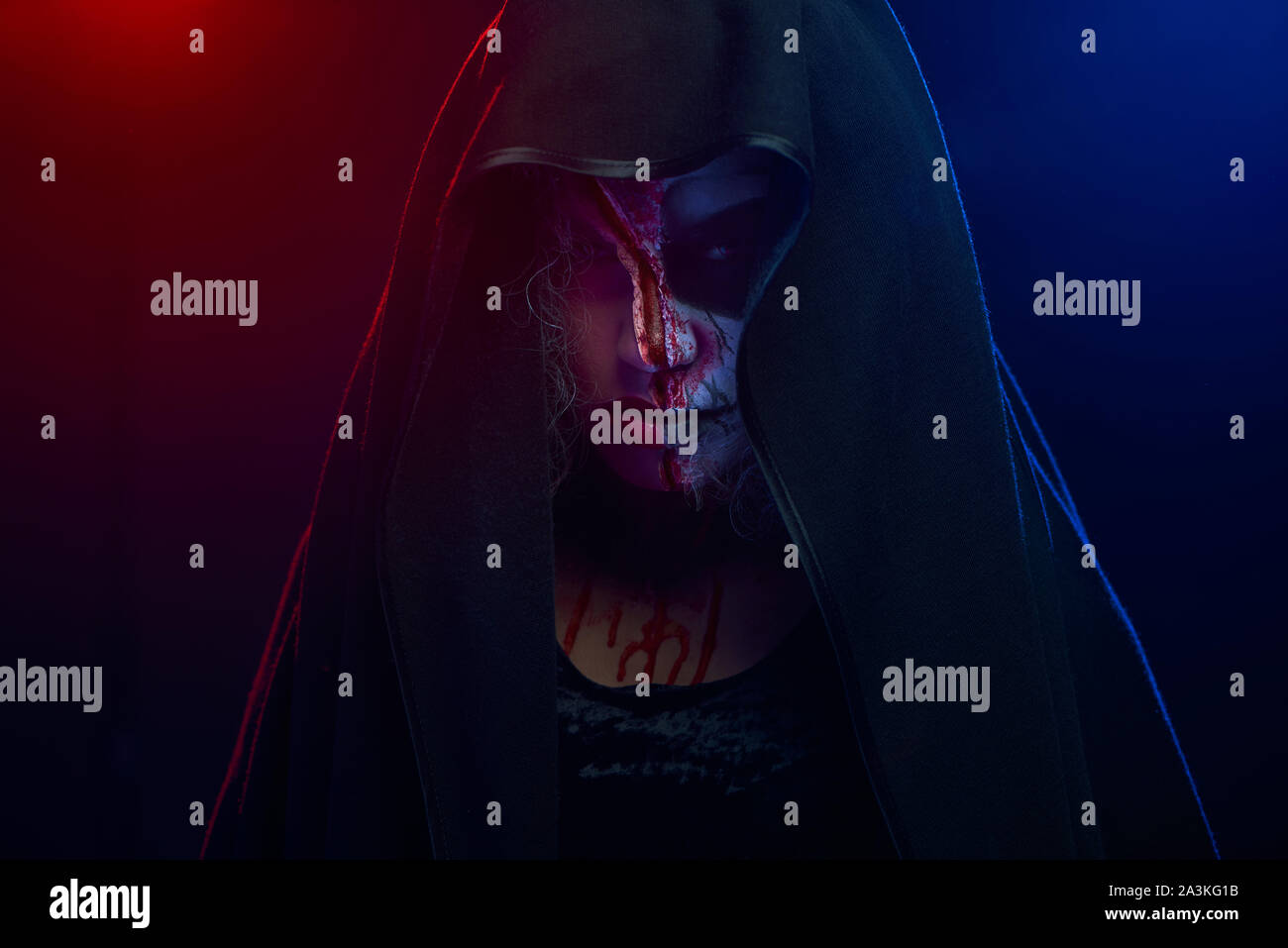 Portrait of horrible scary woman with painted skull face whose head ...