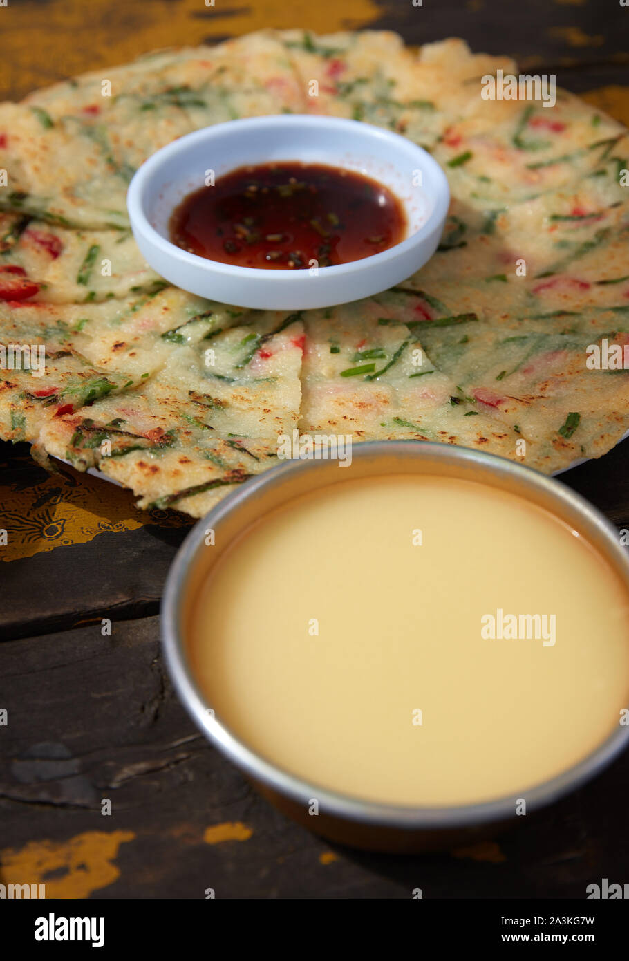 Korean traditional food, Gamjajeon and Makgeolli Stock Photo - Alamy