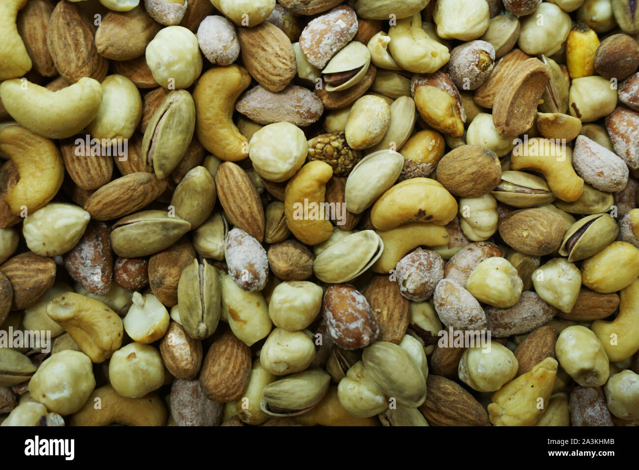 Assortment of mixed dry nuts and fruits, texture background Stock Photo ...