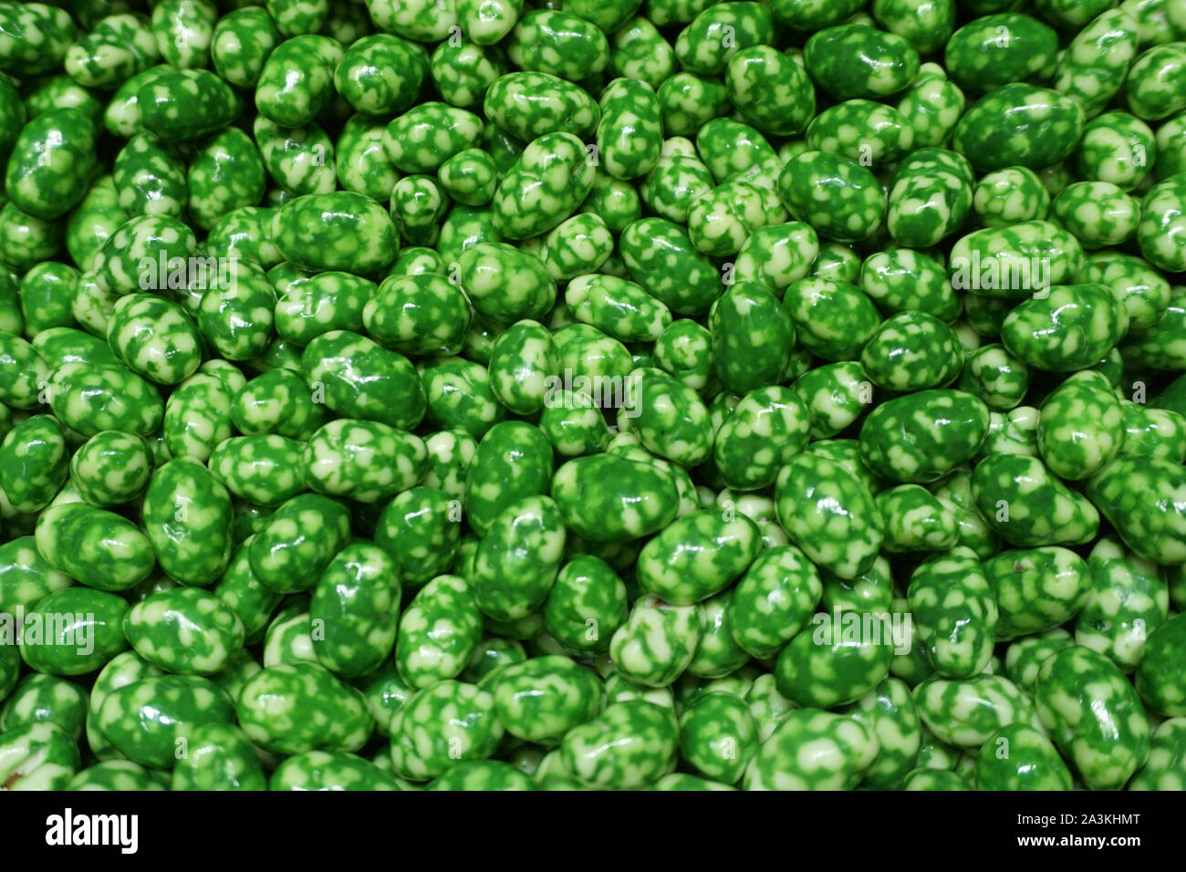 Turkish dragee of pistachios covered in white and green chocolate Stock ...