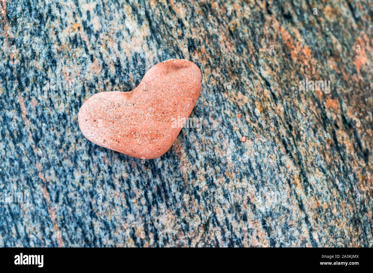 red stone heart figure, sea stone heart shape Stock Photo - Alamy