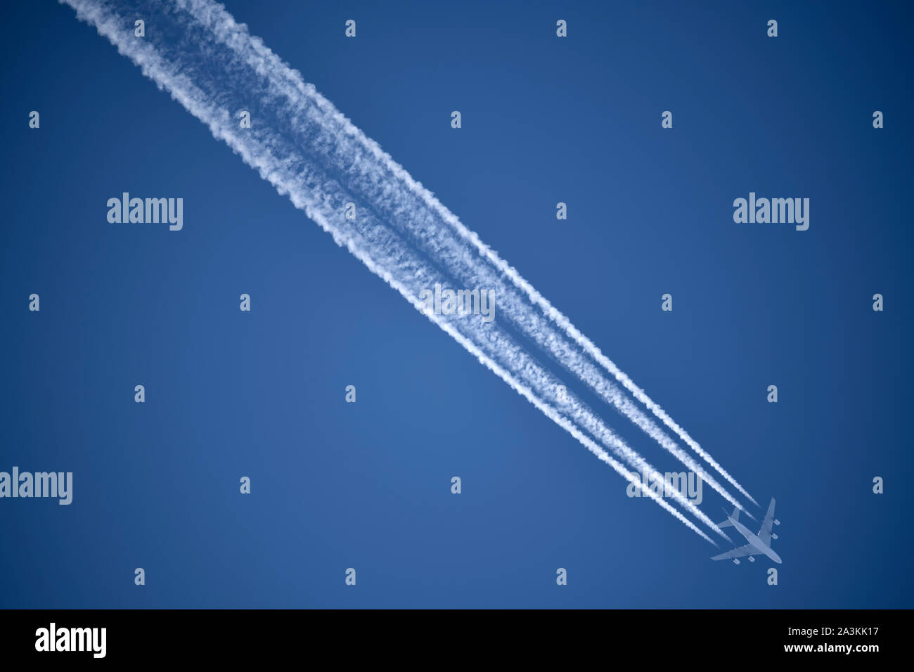 Passenger aircraft with contrails hi-res stock photography and images ...