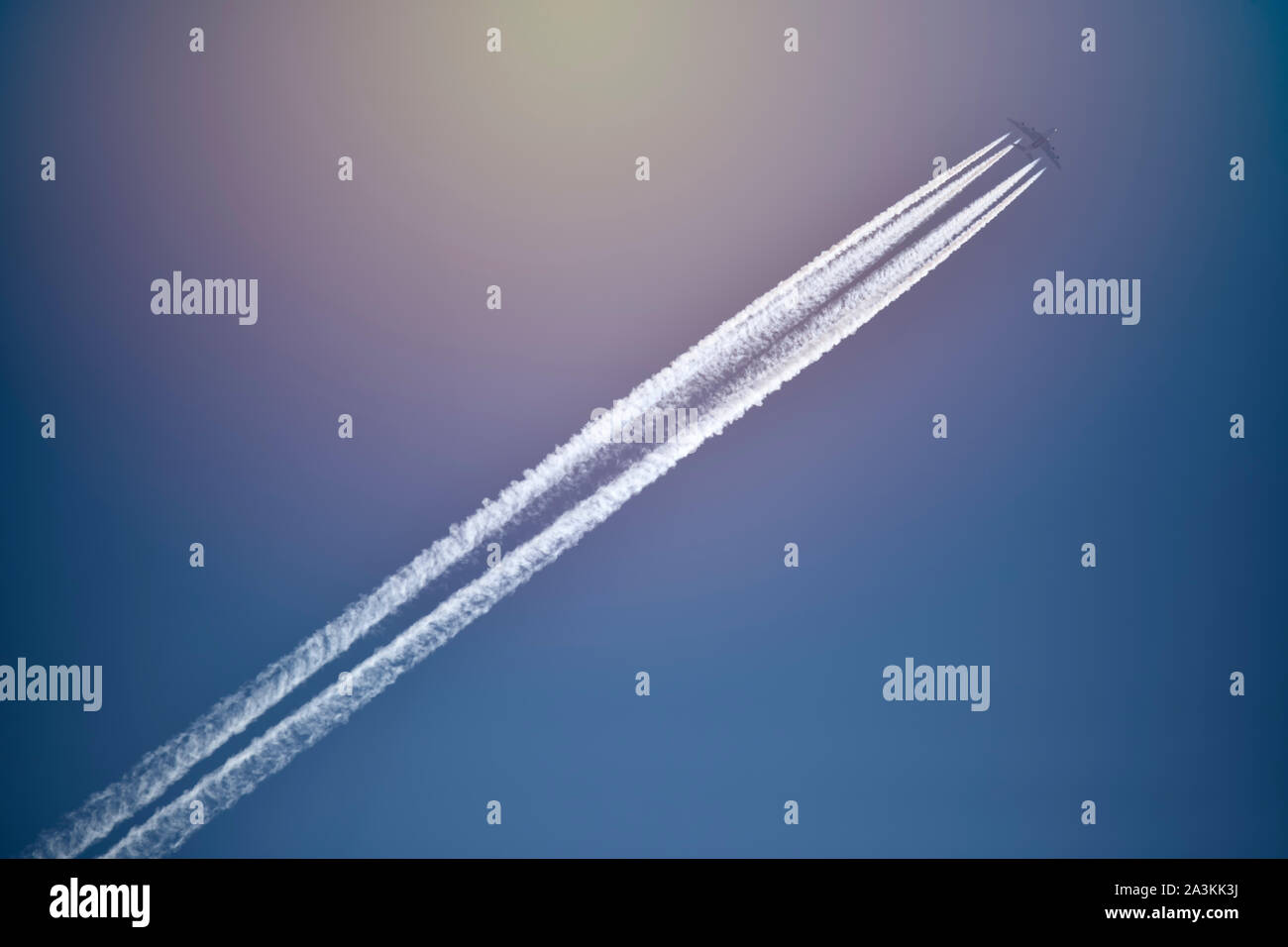Aircraft with contrails Stock Photo - Alamy