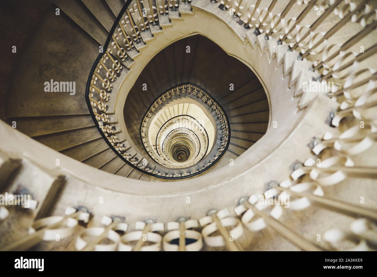 Very deep descending spiral staircase Stock Photo - Alamy