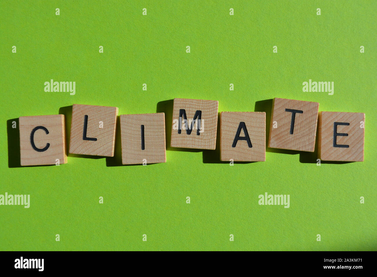 Climate in 3d wooden alphabet letters isolated on a bright green ...