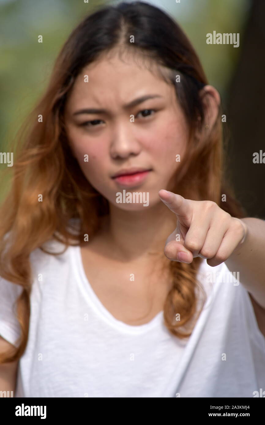 Pointing Asian Female Stock Photo - Alamy