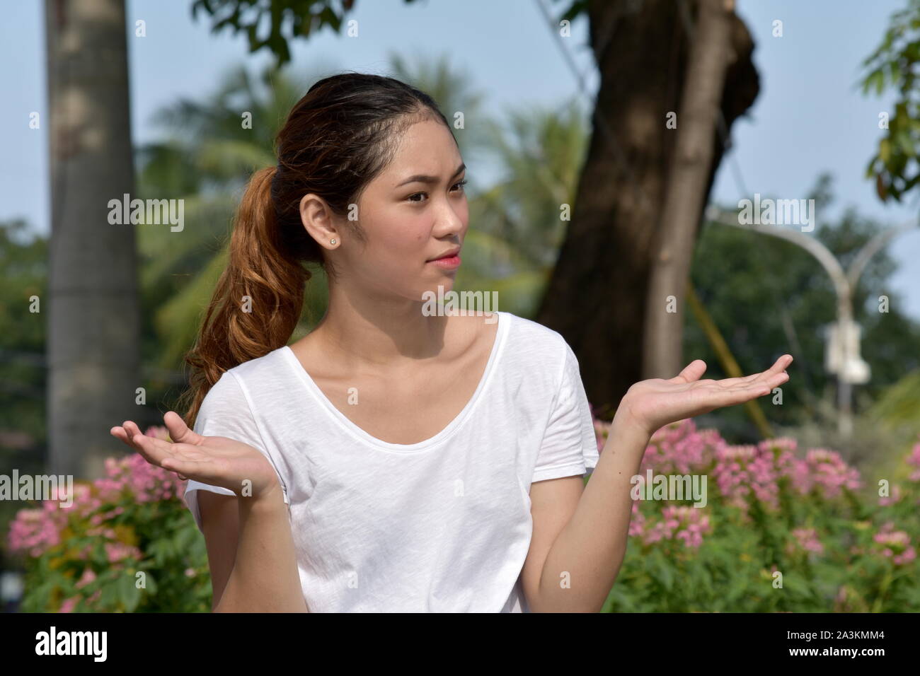 An Undecided Asian Female Woman Stock Photo - Alamy