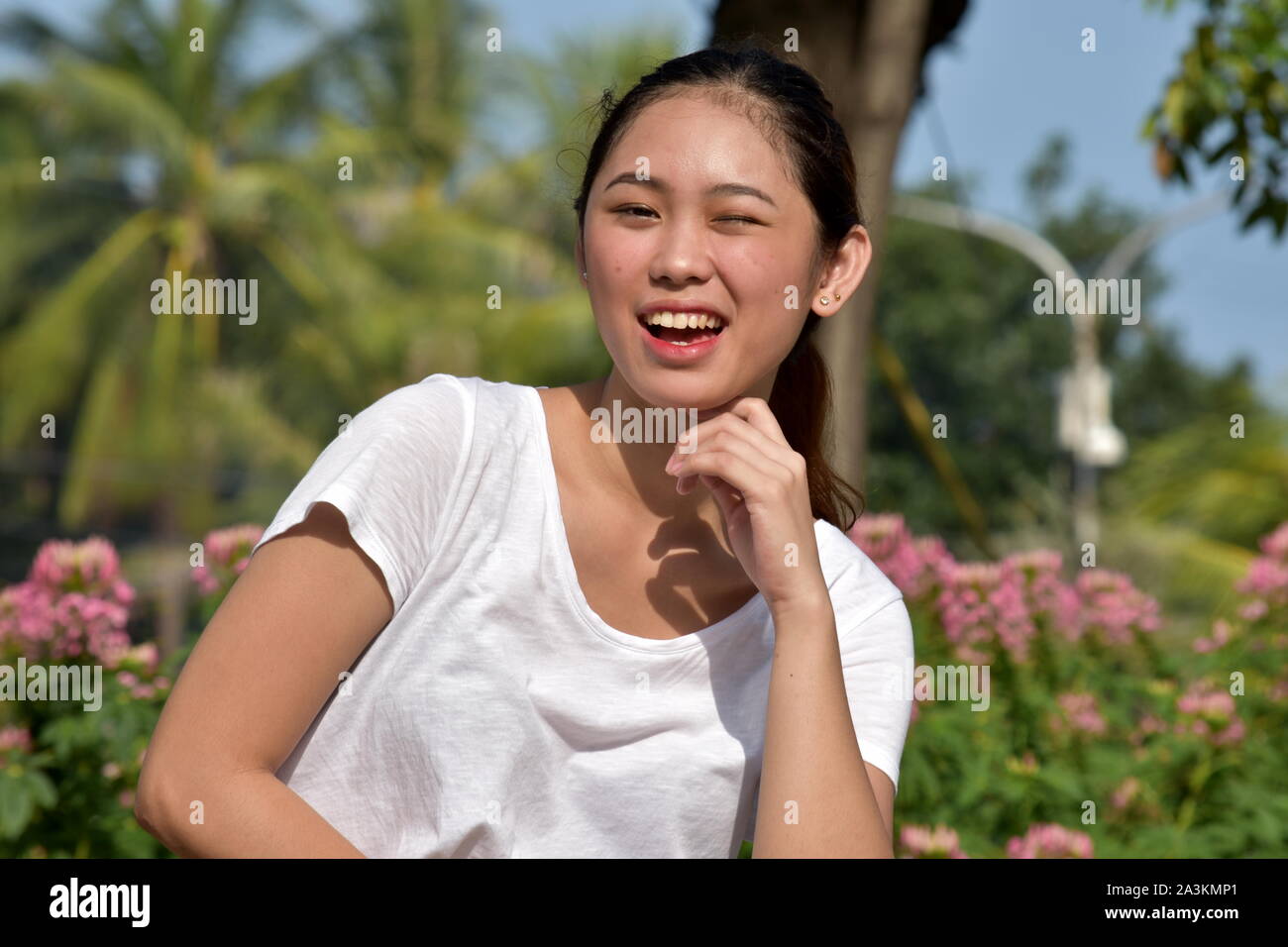 Pretty diverse female winking hi-res stock photography and images - Alamy