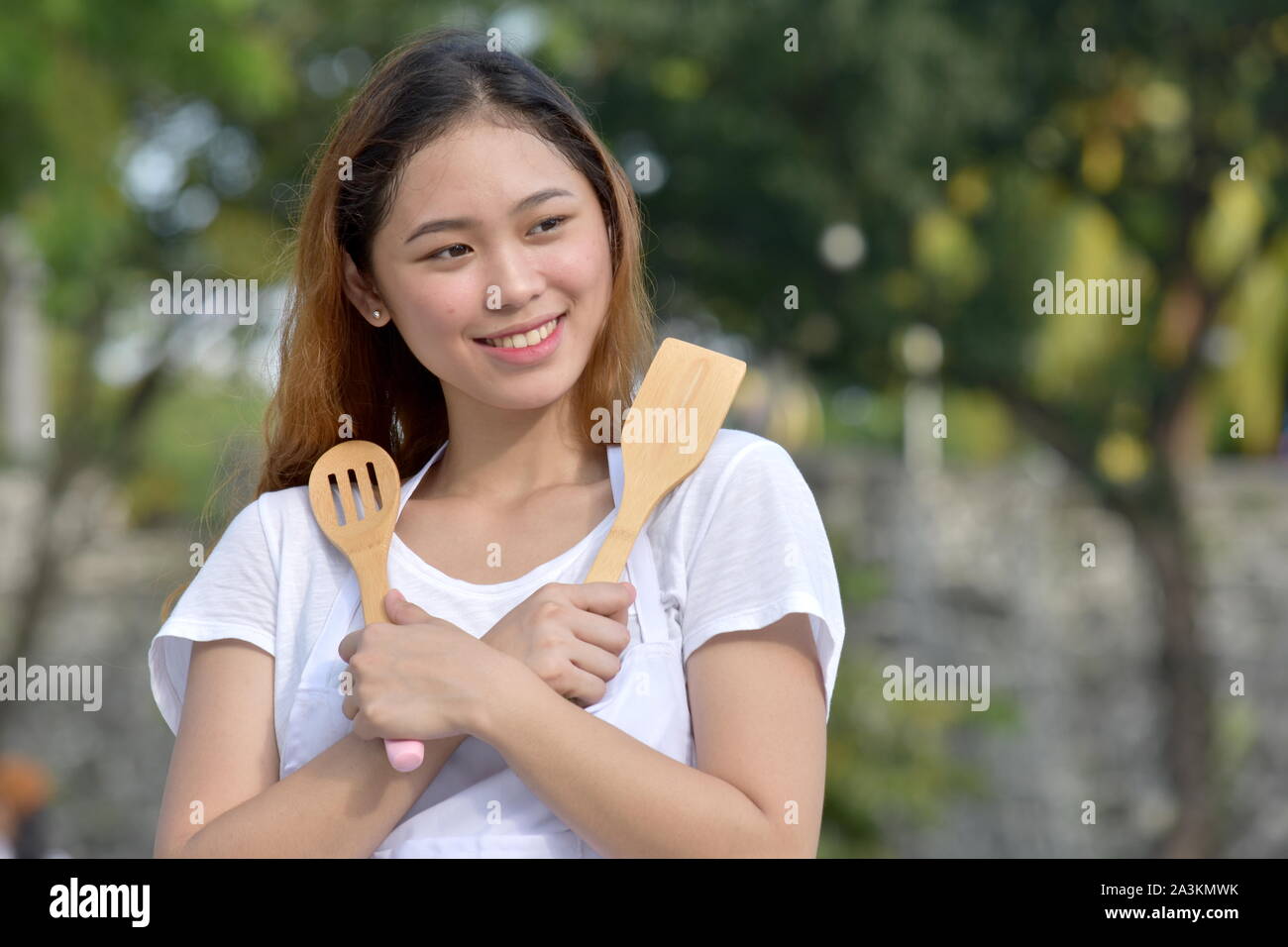 Cook And Happiness Wearing Apron With Utensils Stock Photo - Alamy