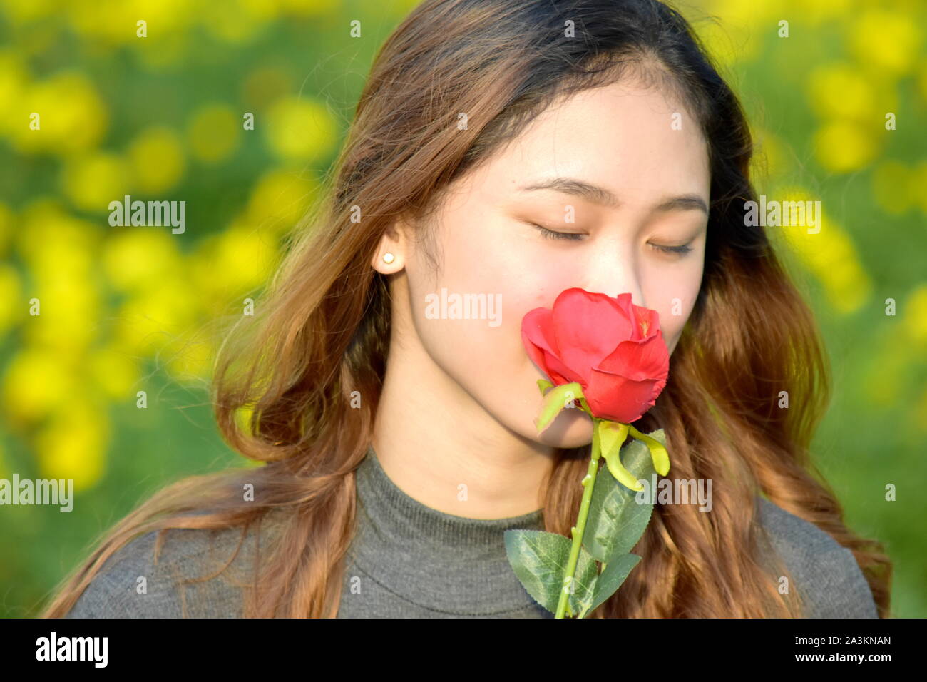Lady smelling plants hi-res stock photography and images - Alamy