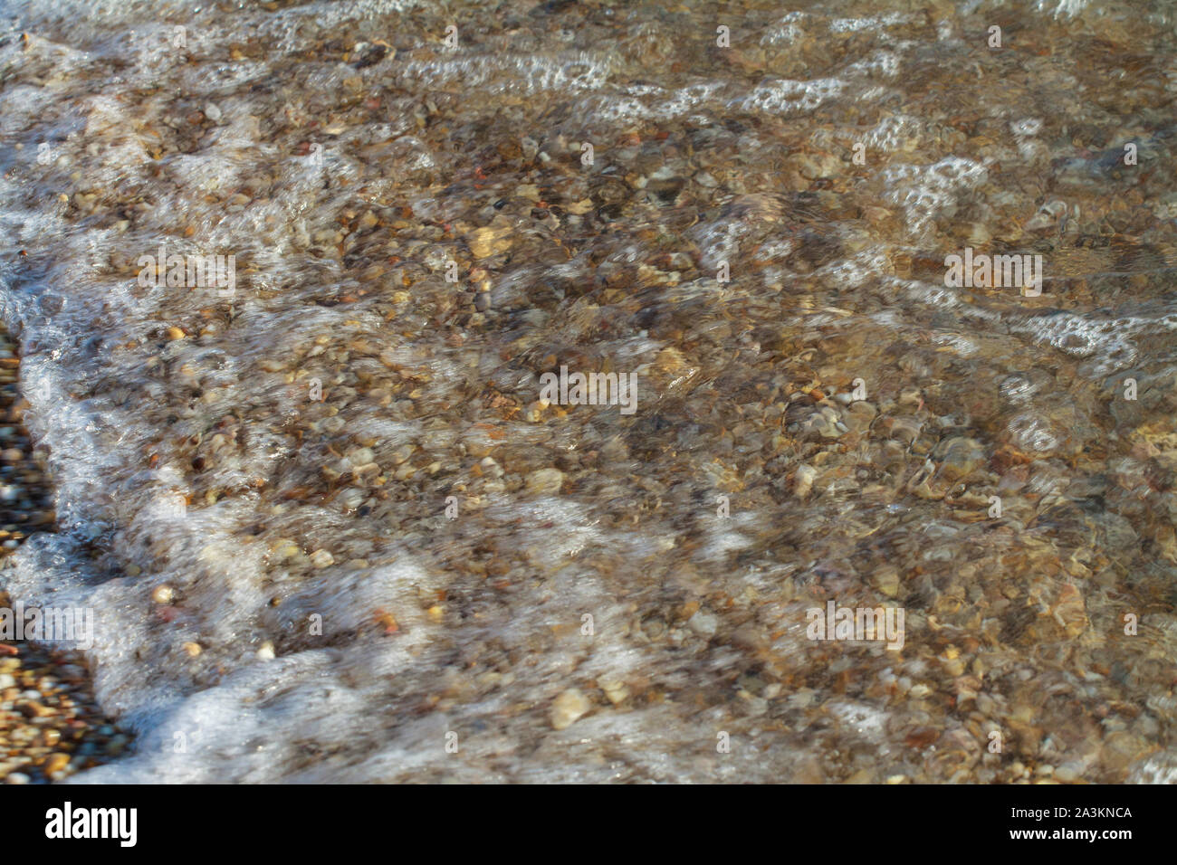 sea pebbles colored granite on the beach background stones. The shore ...