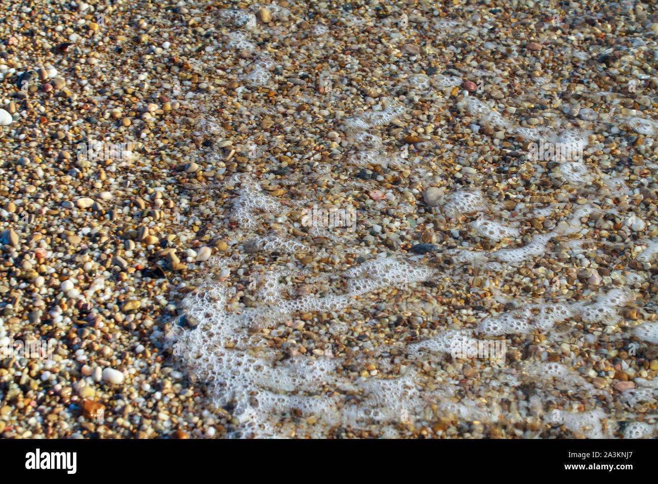 sea pebbles colored granite on the beach background stones. The shore ...