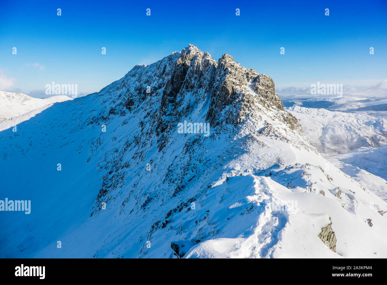 Crib Goch, Snowdonia, in winter snow. Classic British winter ...