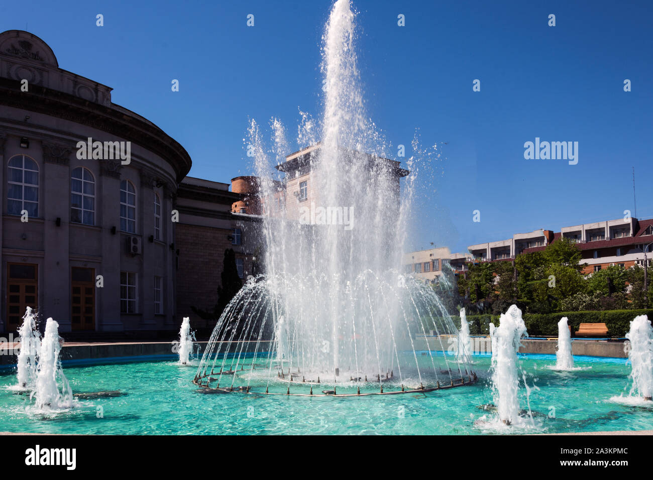 Beautiful fountain in the city . Summer day. City landscape. Waterfall ...