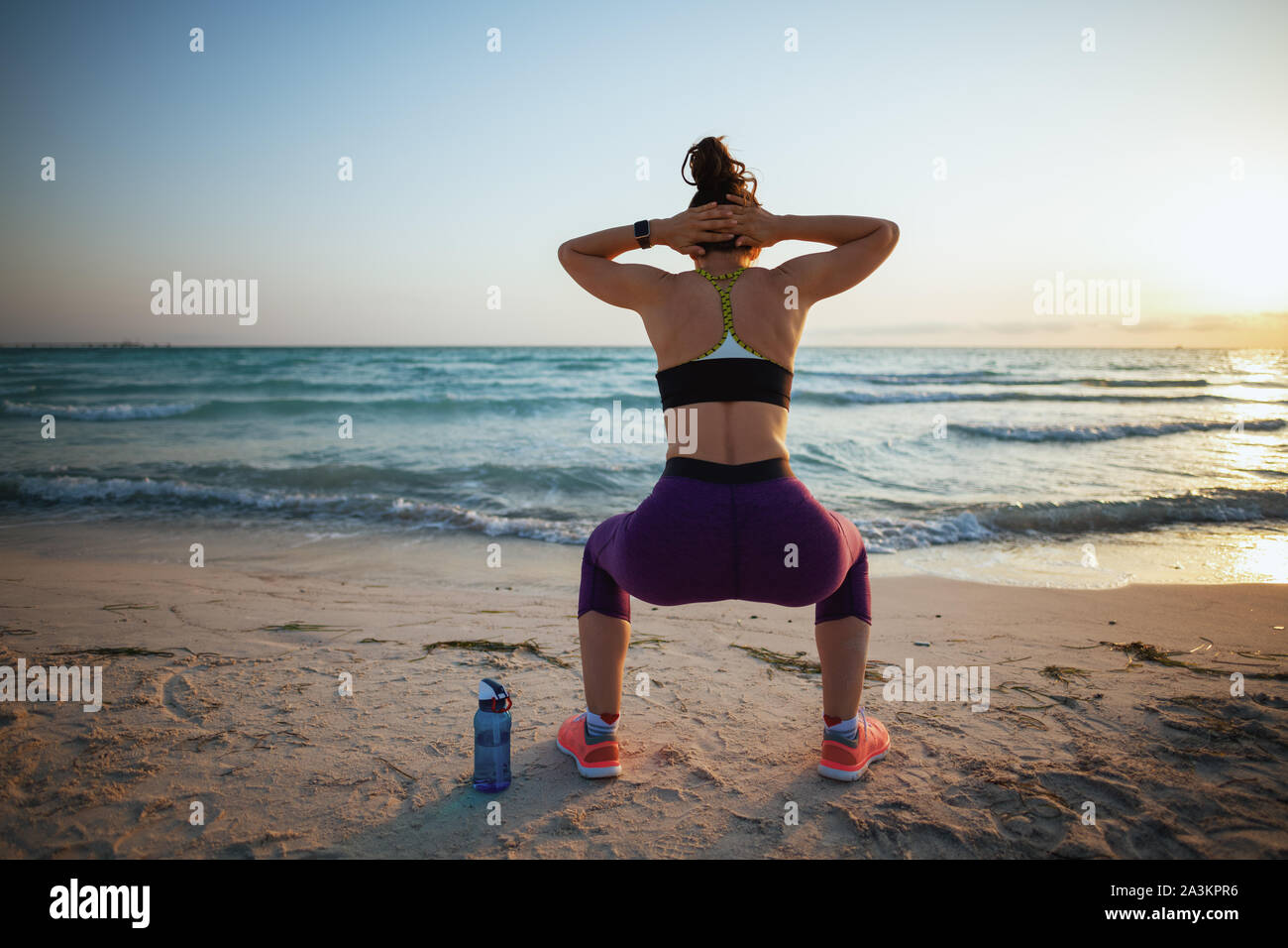 Woman squats rear view hi-res stock photography and images - Alamy