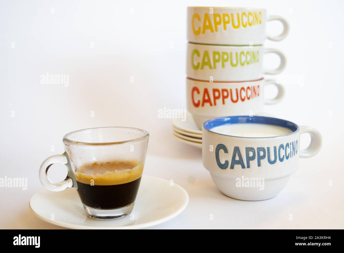 cup with cappuccino written empty of fresh milk and espresso coffee ...