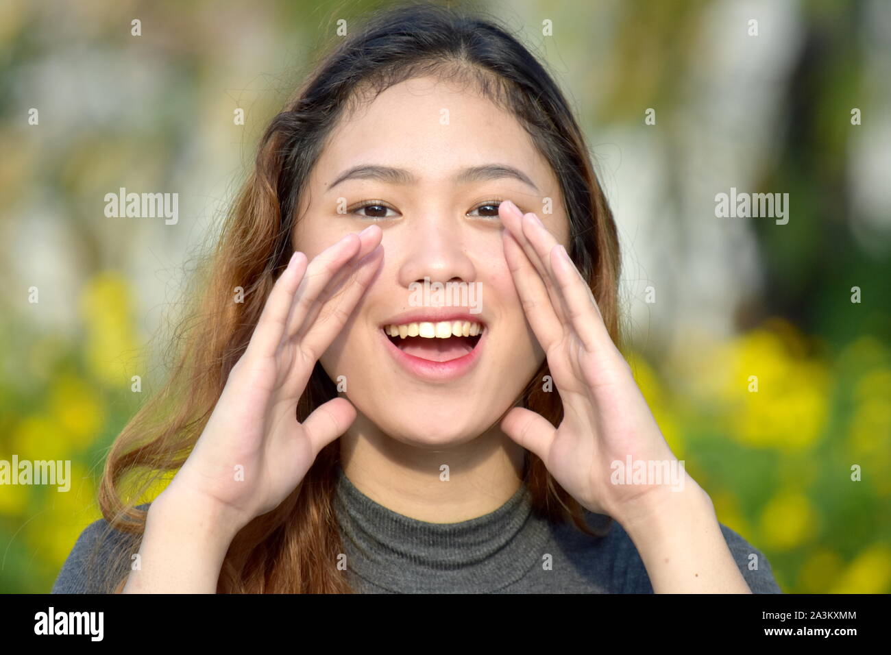 Pretty Filipina Woman Talking Stock Photo - Alamy