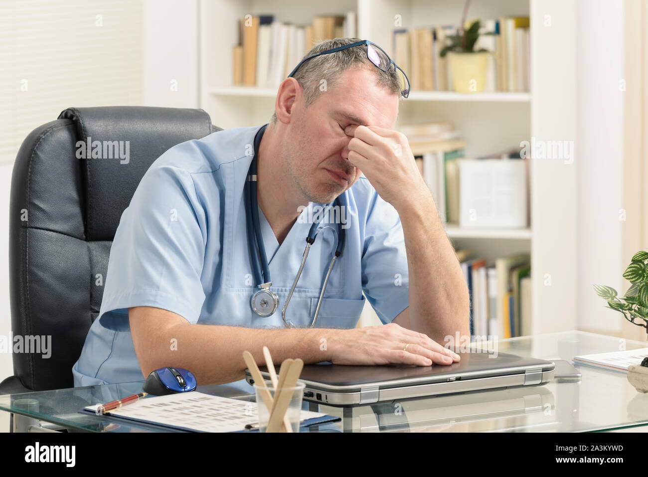 Male doctor upset sitting in hi-res stock photography and images - Alamy