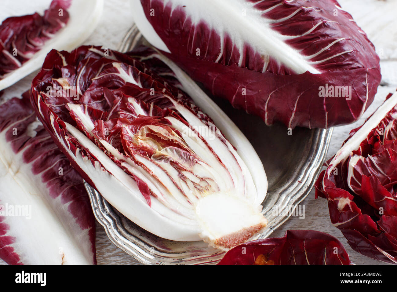 Raw red chicory on a tray close up Stock Photo - Alamy