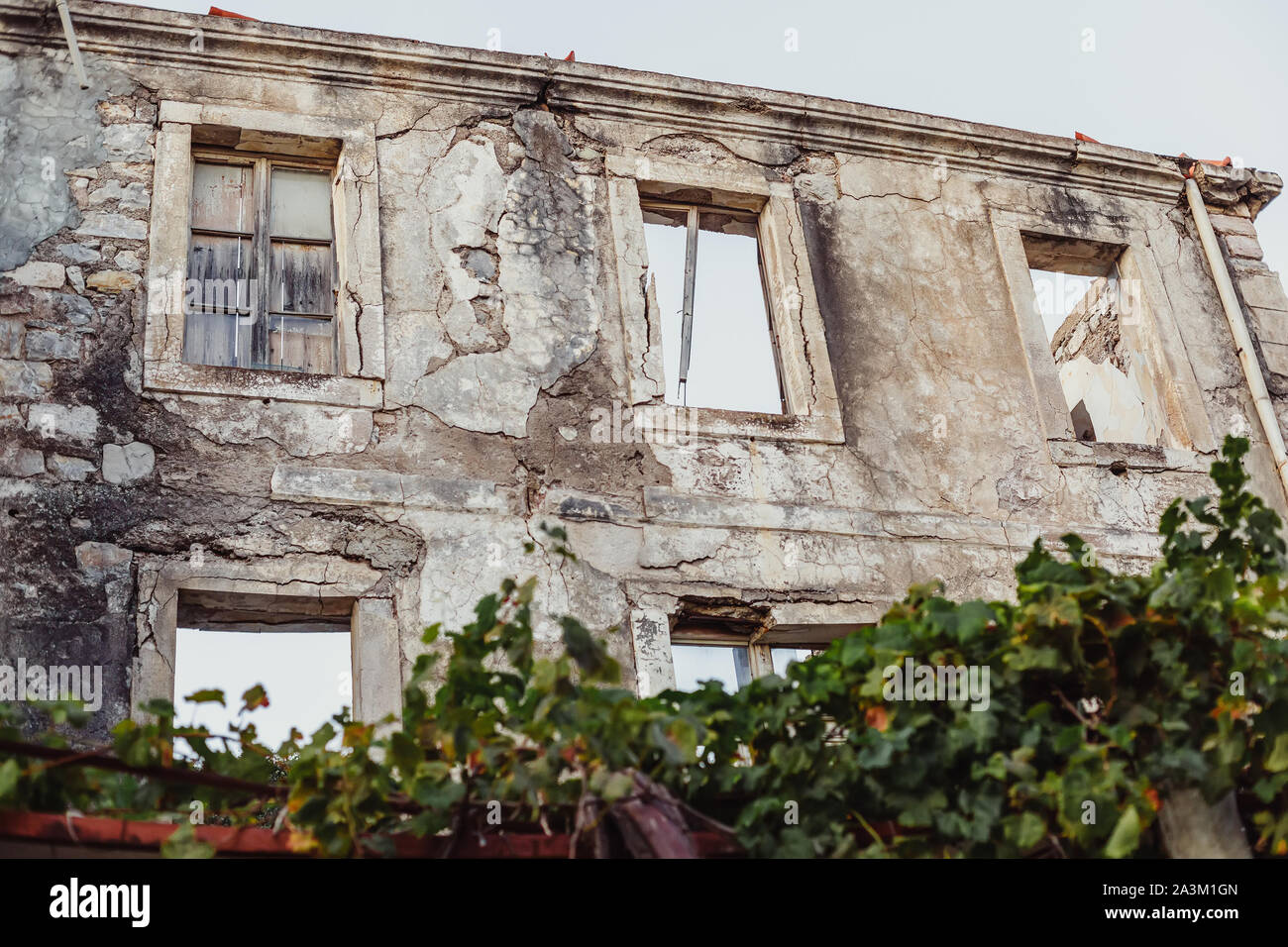 Remains of old ruined house, cracked wall with broken windows Stock ...