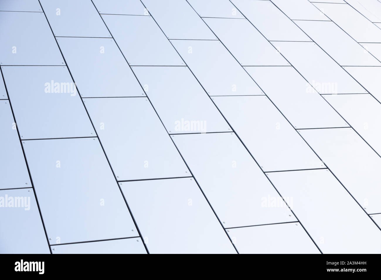 Wide angle view of white smooth matte wall of geometrically designed ...