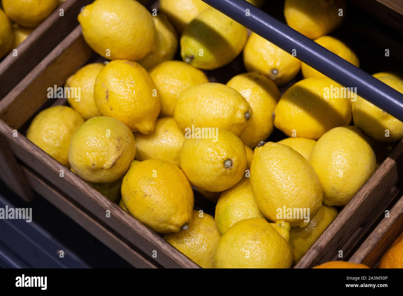 Many wooden boxes with fresh yellow lemons rich in nutrients Stock ...