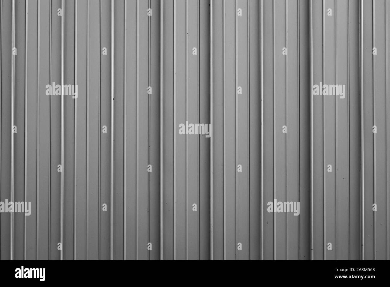Front view of gray ribbed metal surface on fence or wall for backdrop ...