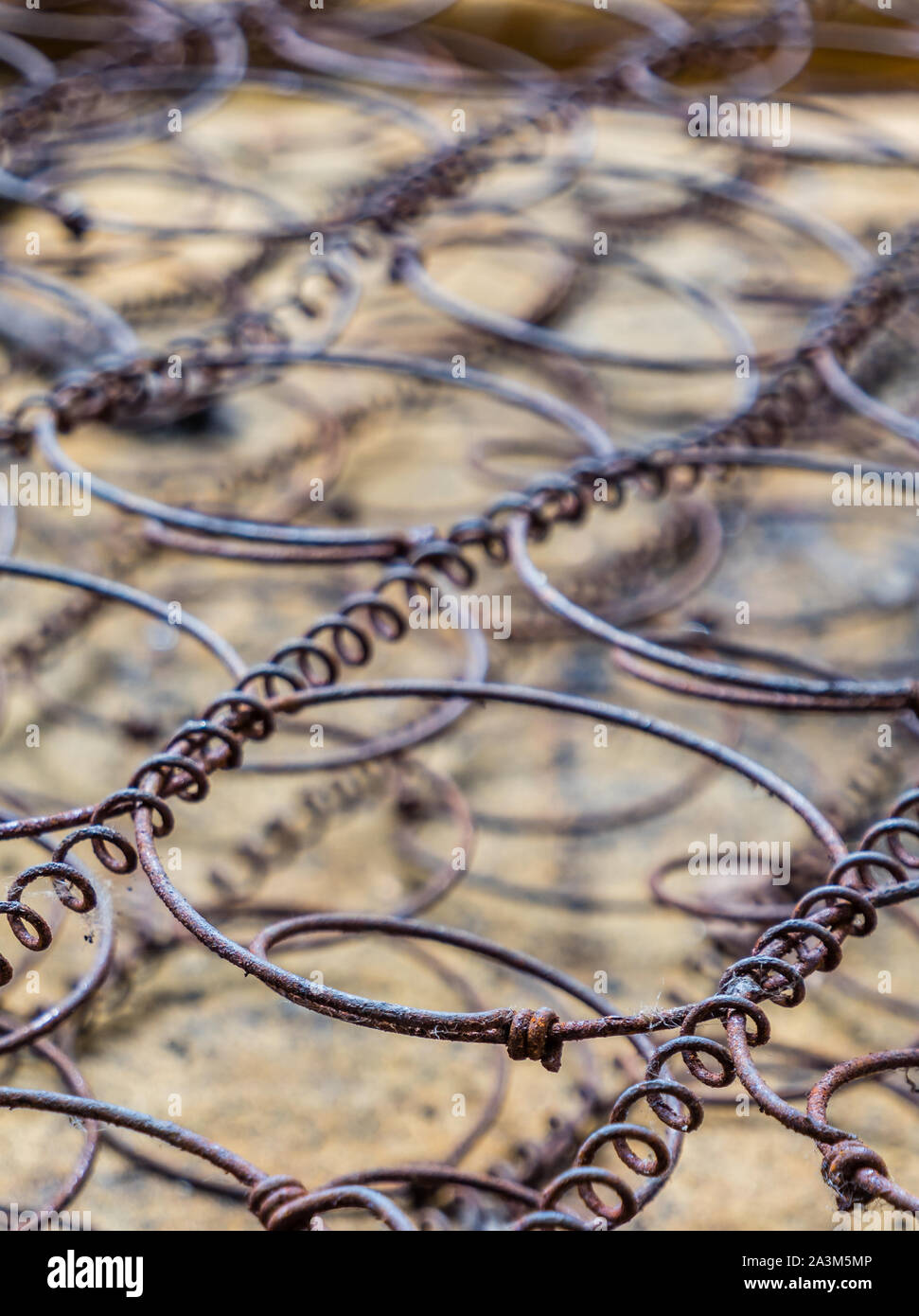 Metal springs of an old mattress Stock Photo - Alamy