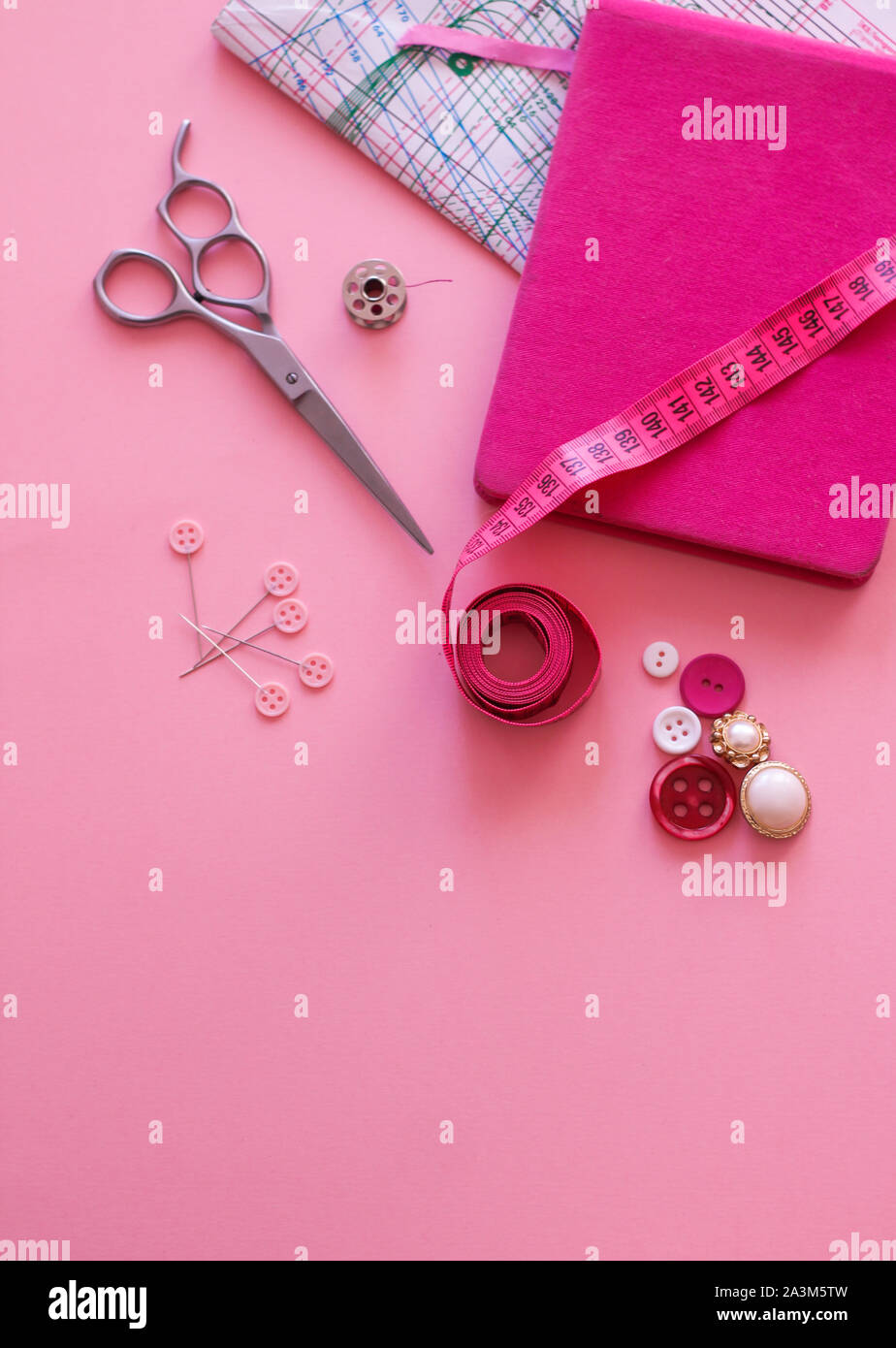 Pink composition of sewing objects Stock Photo - Alamy