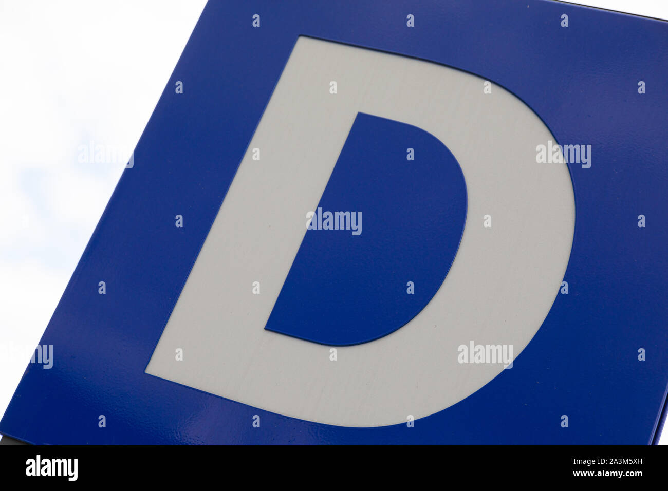 Blue tablet with white letter D on it Stock Photo - Alamy
