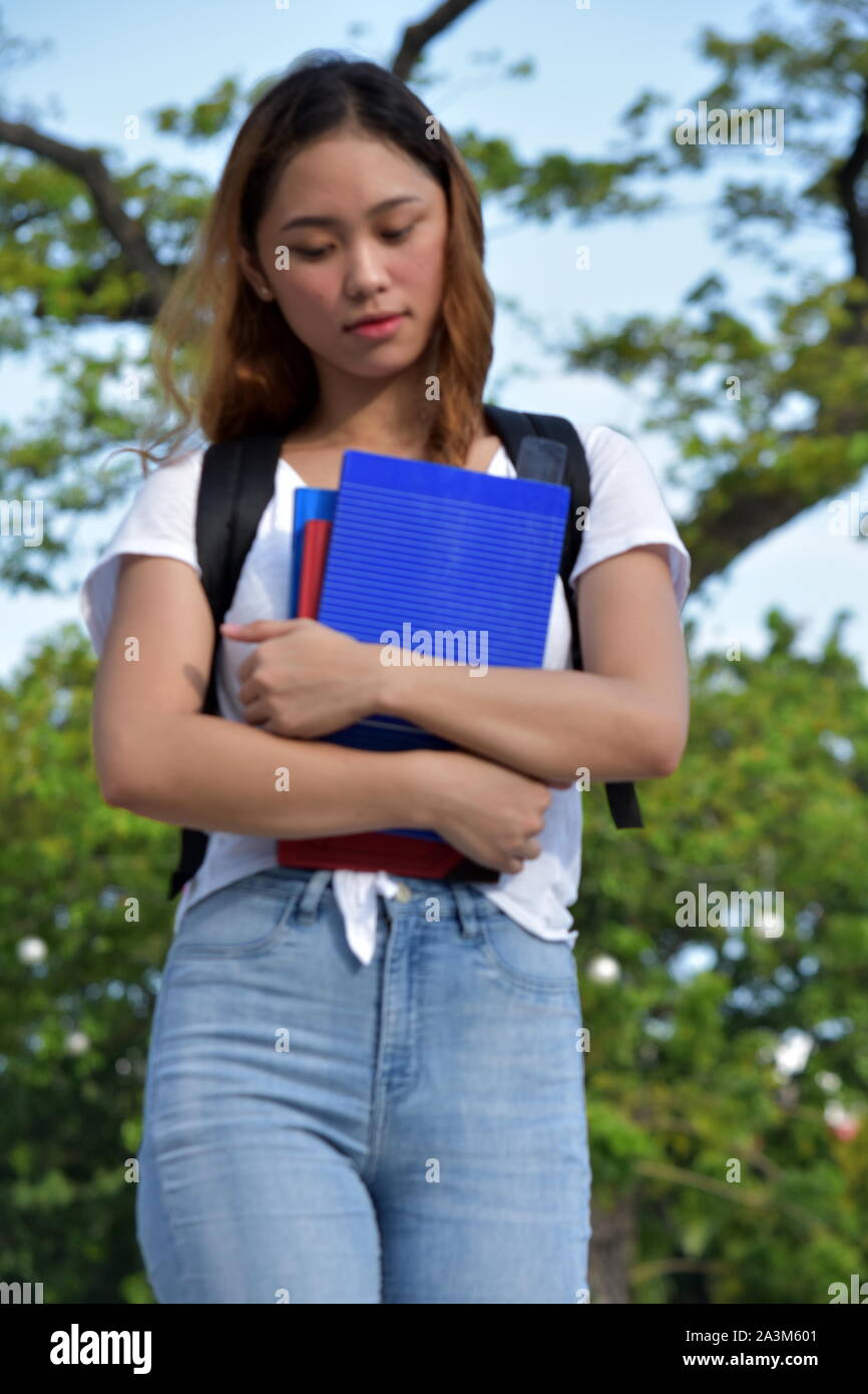 Sad asian girl books hi-res stock photography and images - Alamy