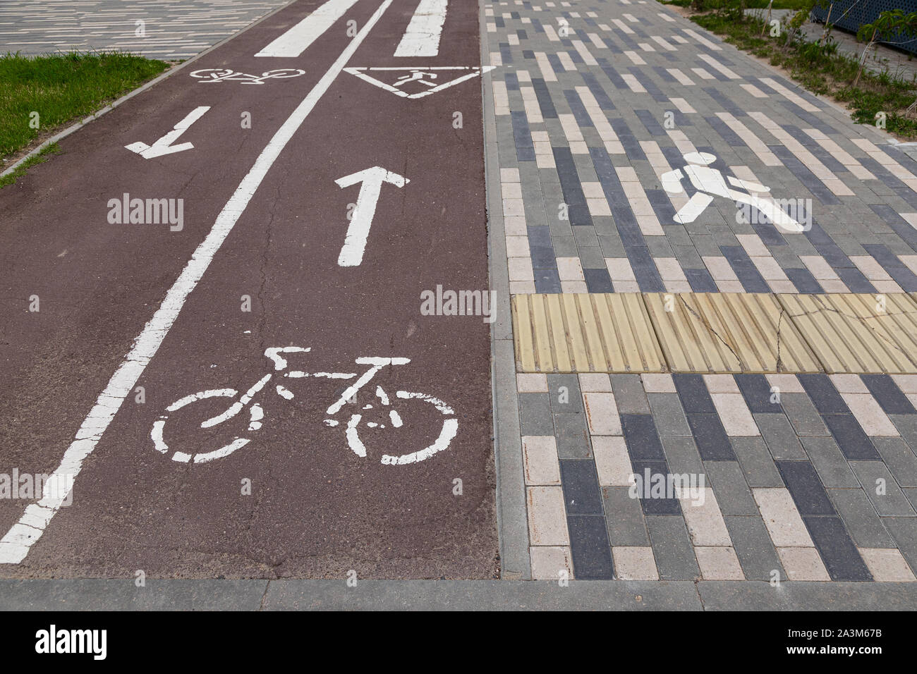 Pedestrian path and bikeway with road marking Stock Photo - Alamy