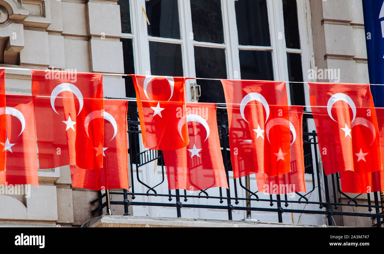 Turkish national flags with white star and moon in sky Stock Photo - Alamy