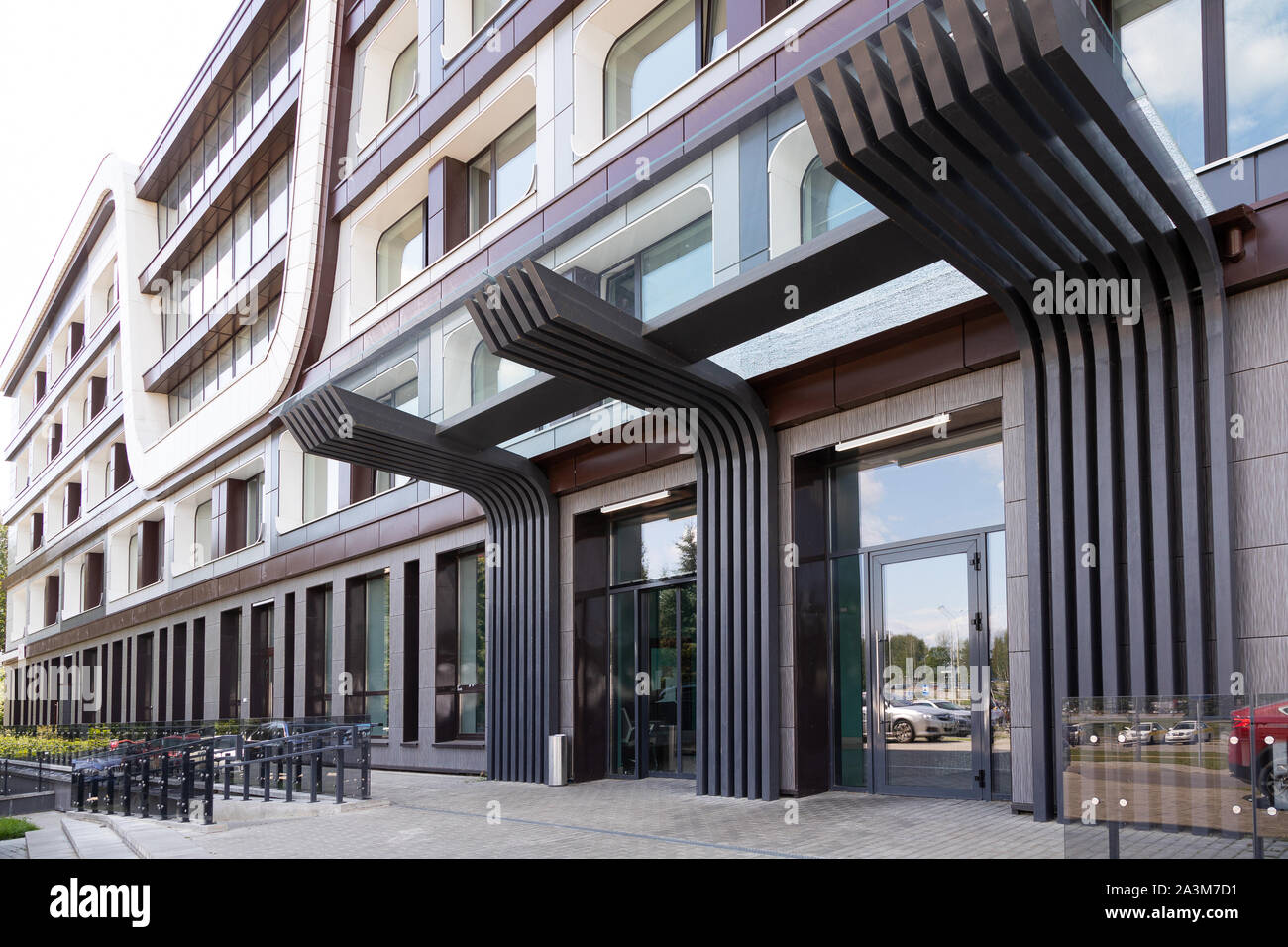 modern building with beige and brown tiled walls diagonal angle view ...