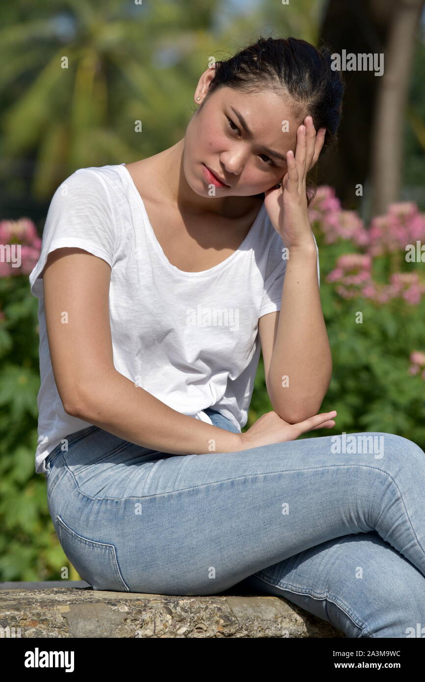 Sad Youthful Filipina Woman Stock Photo - Alamy